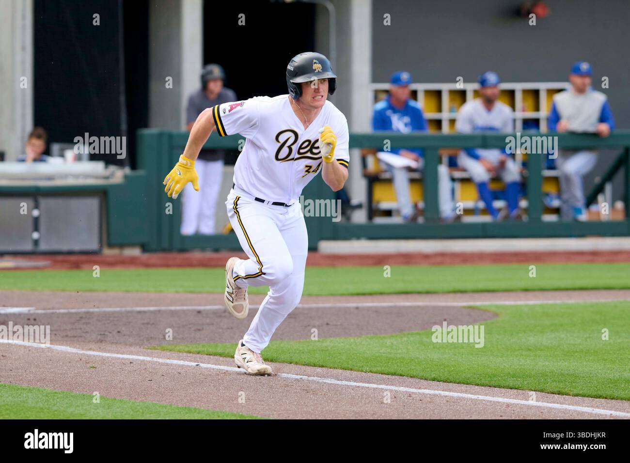 Tucker Flint (34) of the Salt Lake Bees sprints to first base against ...