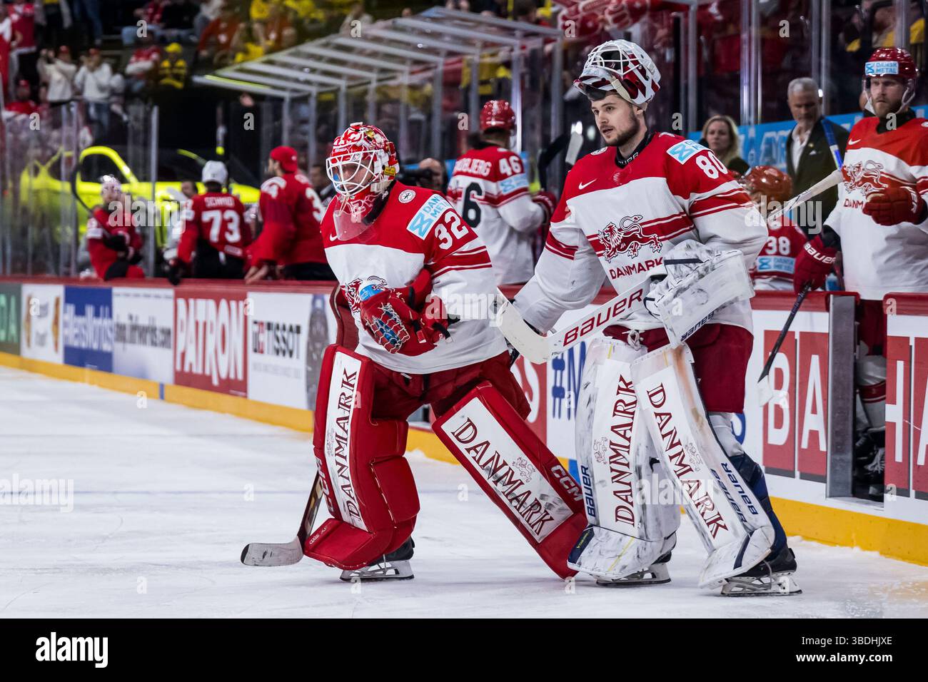 Goaltender Sebastian Dahm and goaltender Frederik Dichow of, Denmark. , . during the 2025 IIHF ...