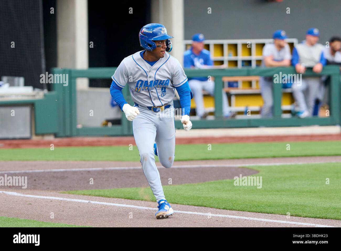 Tyler Tolbert (3) of the Omaha Storm Chasers sprints to first base ...