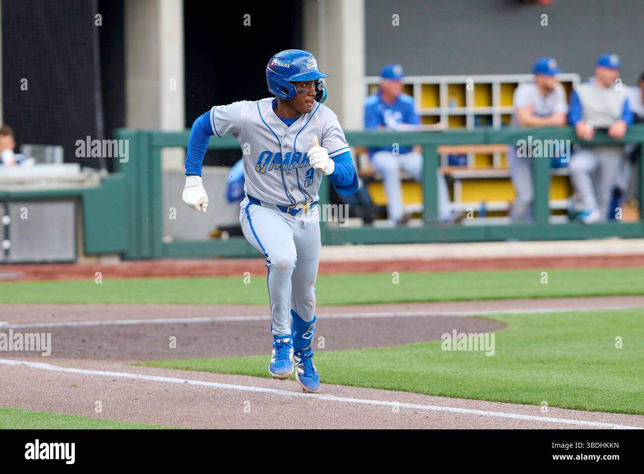 Tyler Tolbert (3) of the Omaha Storm Chasers sprints to first base ...