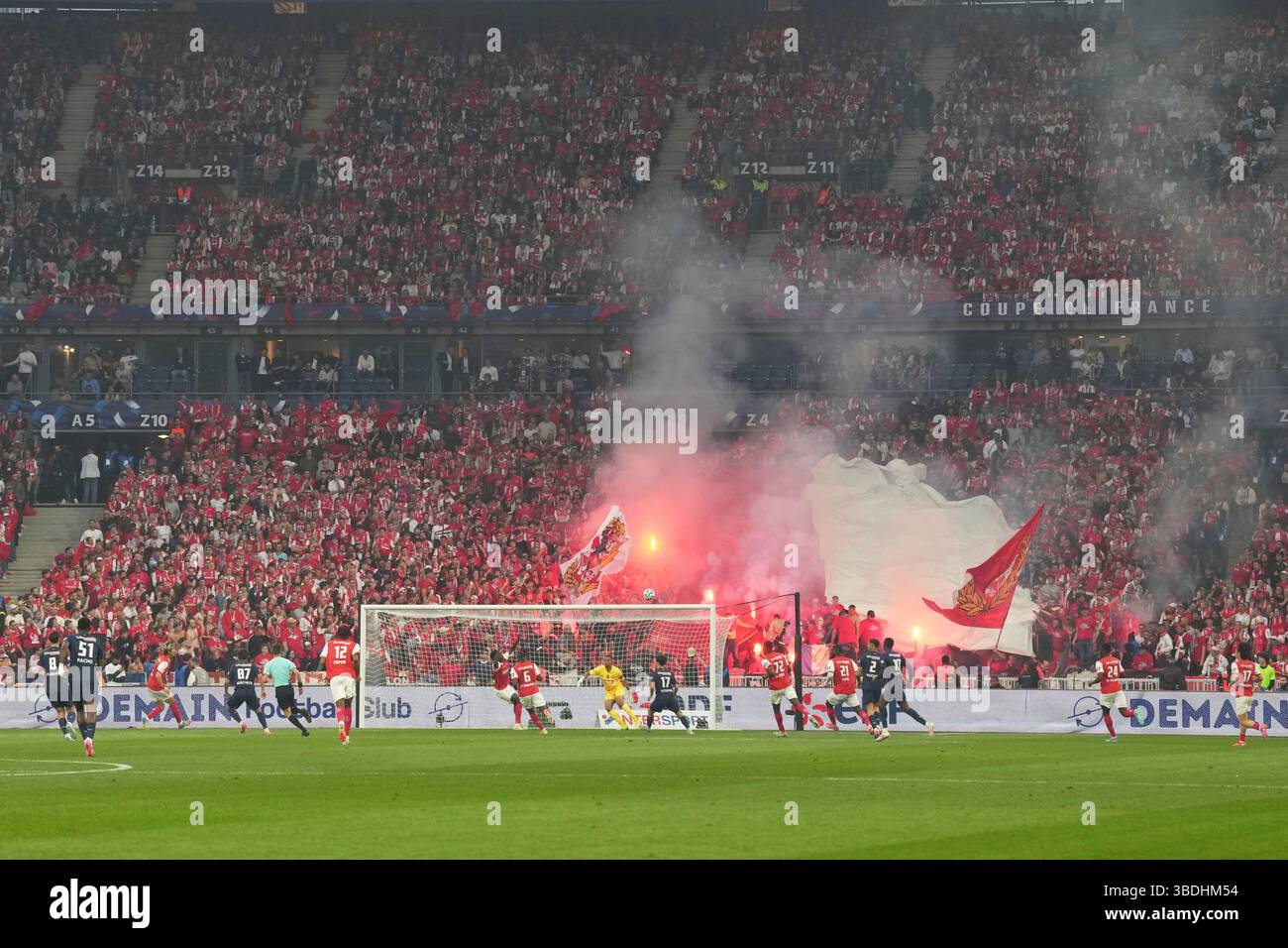 Fans light up flares during the French Cup soccer final between Paris ...