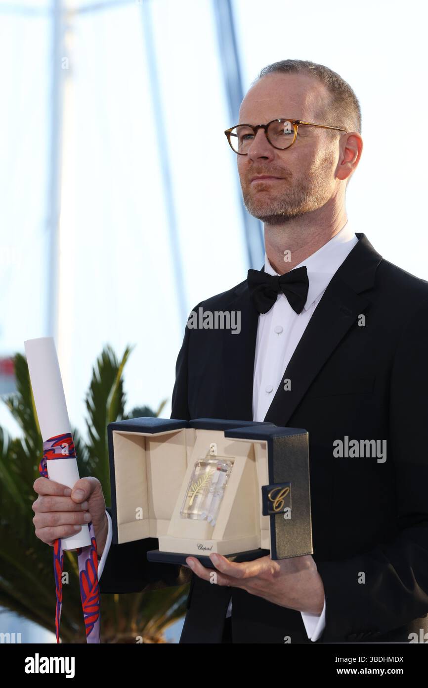 Cannes, France. 24th May, 2025. CANNES, FRANCE - MAY 24: Joachim Trier poses with the Grand Prix ...