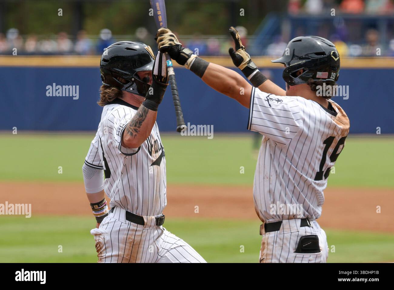 HOOVER, AL - MAY 24: Vanderbilt infielder Jonathan Vastine (13) gets a ...