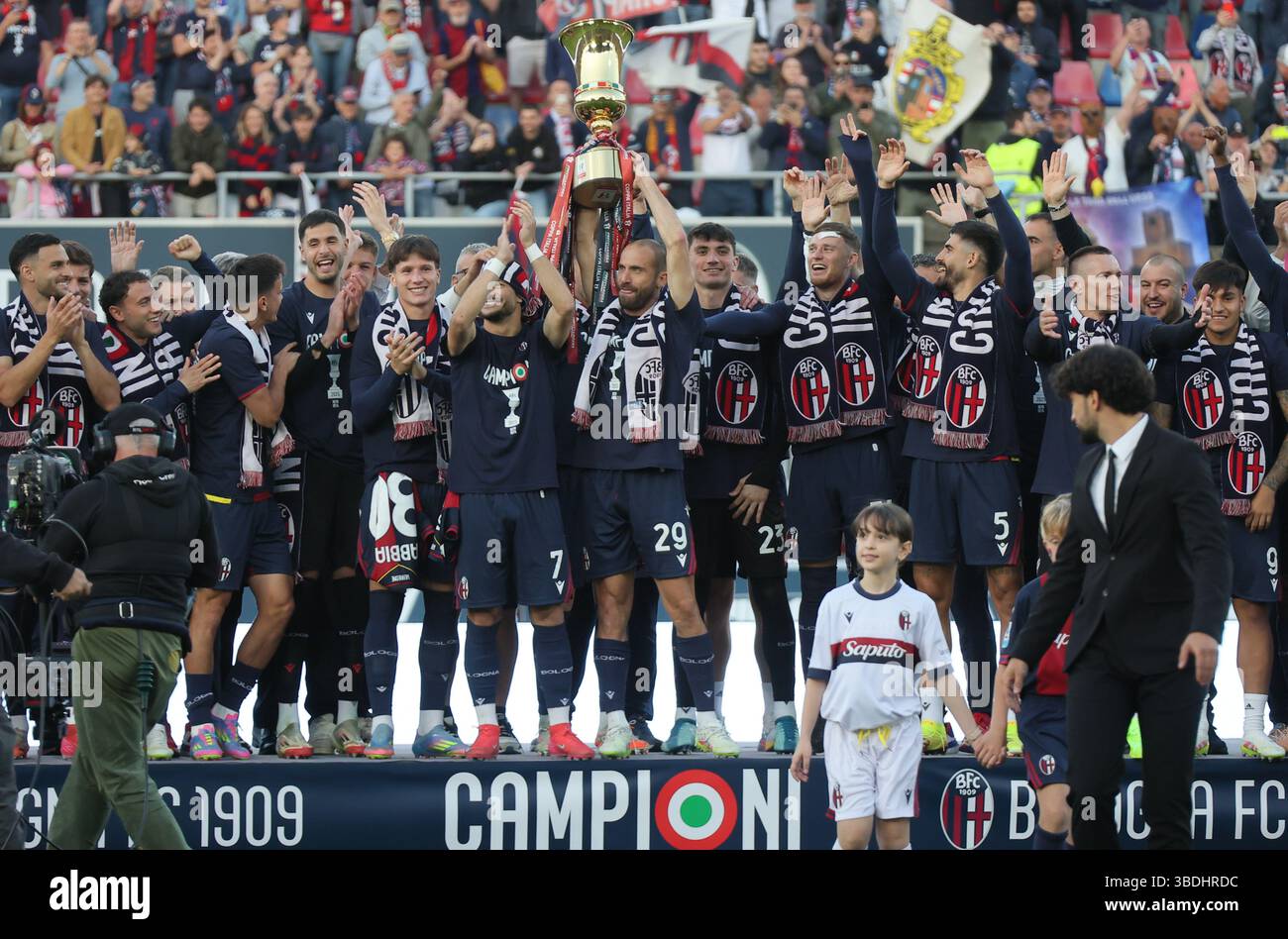 the bologna team celebrates with the italian cup won last week at th ...