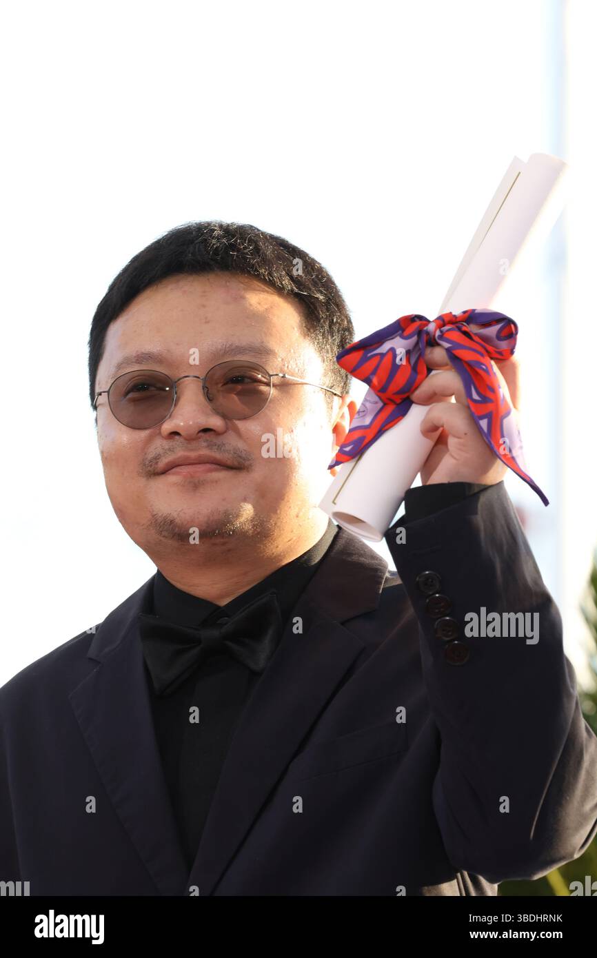 Cannes, France. 24th May, 2025. CANNES, FRANCE - MAY 24: Bi Gan poses ...
