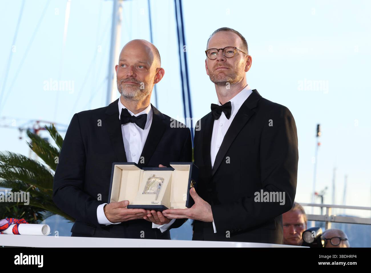 Cannes, France. 24th May, 2025. CANNES, FRANCE - MAY 24: Eskil Vogt and Joachim Trier pose with ...