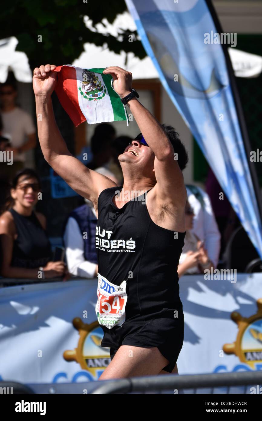Laredo, Spain, 24-05-2025: Mexican athlete with the flag crossing the ...