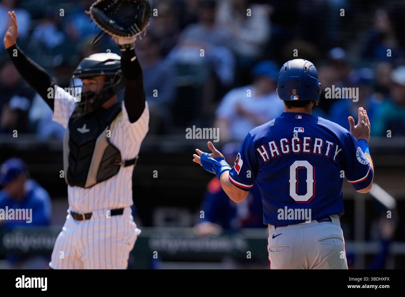 Texas Rangers' Sam Haggerty (0) scores on a double from Josh Smith (8 ...