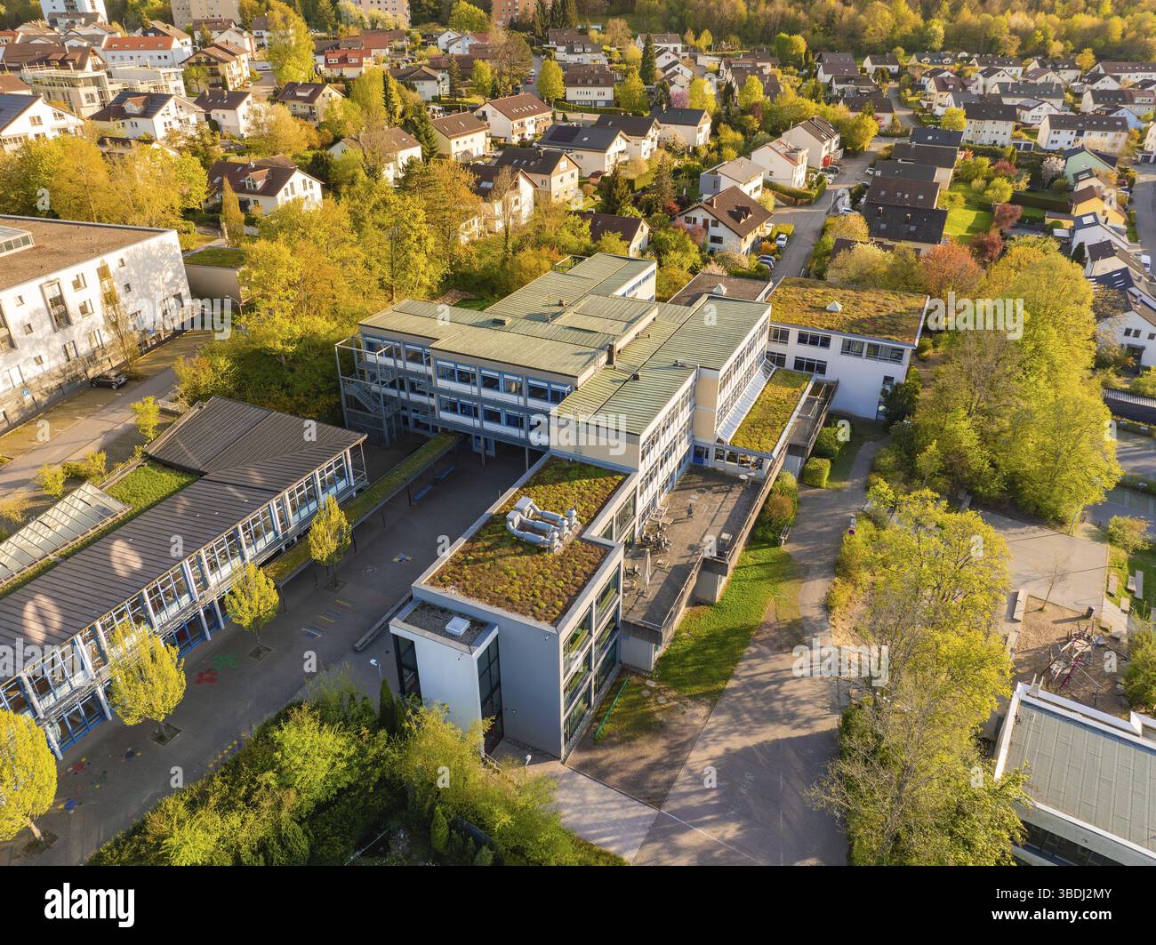 Urban landscape with modern groups of buildings and green roofs seen ...