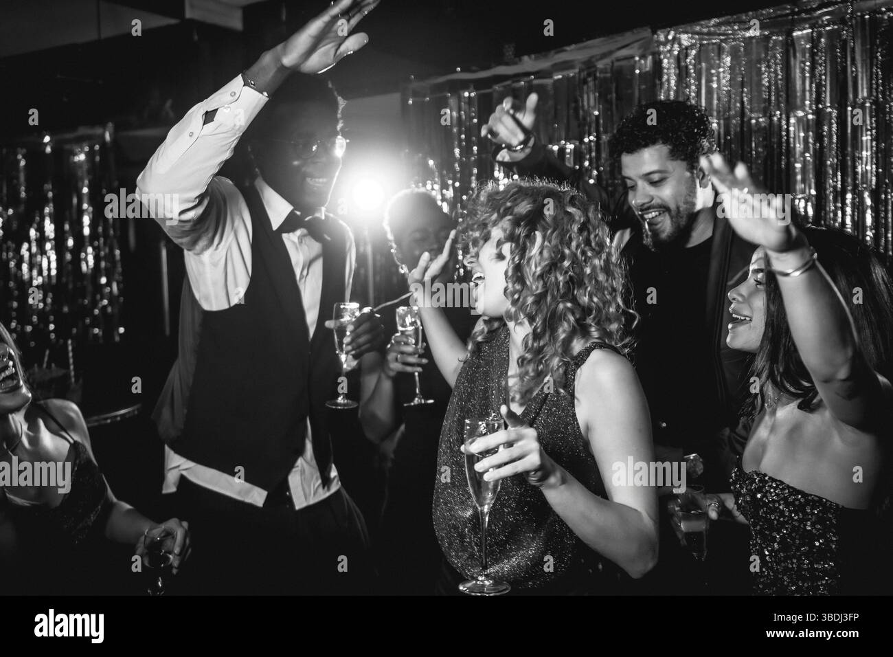Group of stylish friends enjoying an exciting night out, dancing and ...