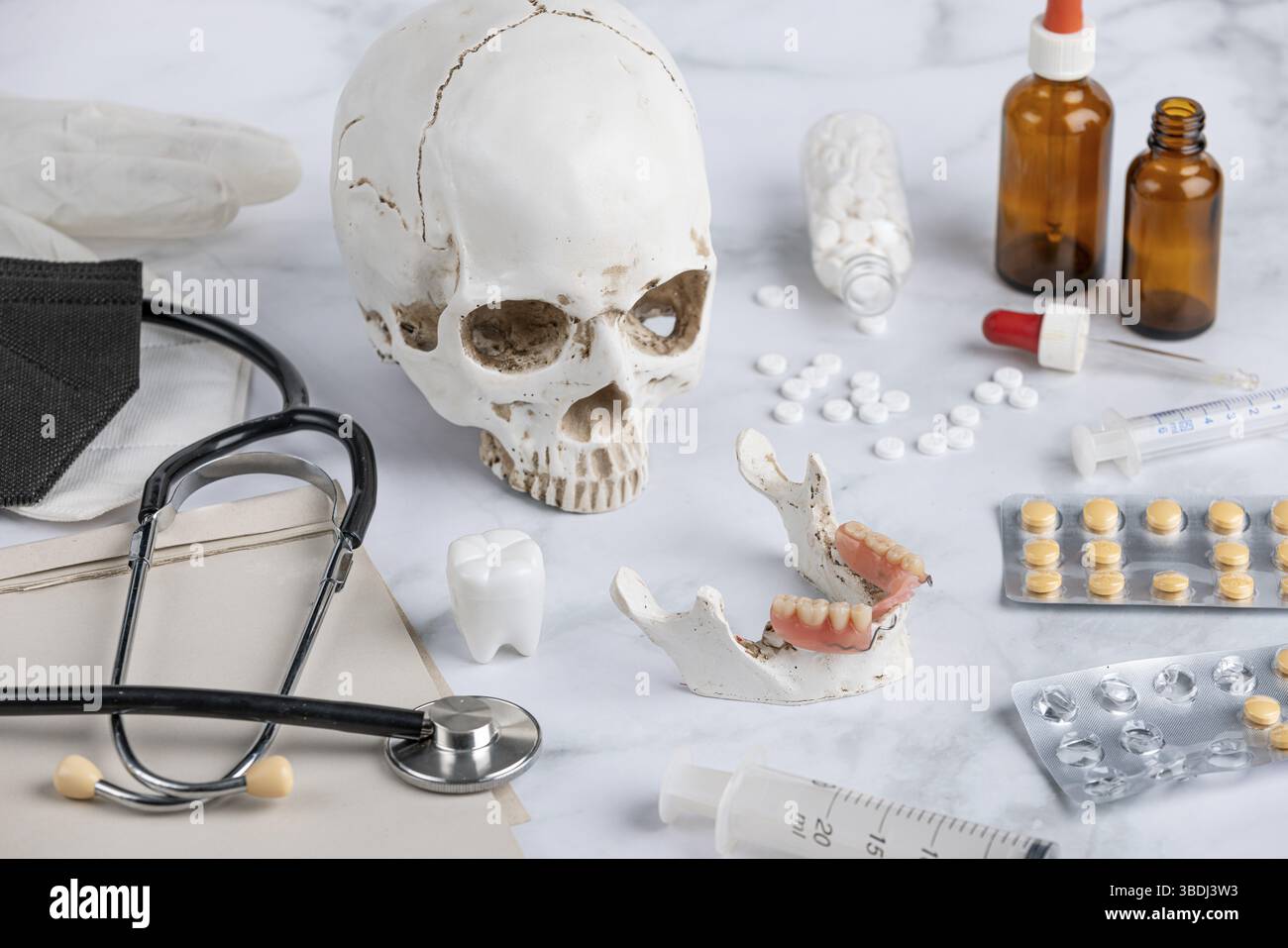Medical utensils, tablets with skull and teeth Stock Photo - Alamy