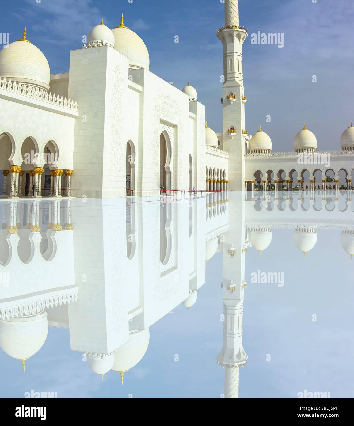 Sheikh Zayed Grand Mosque with minaret, domes and columns reflecting ...