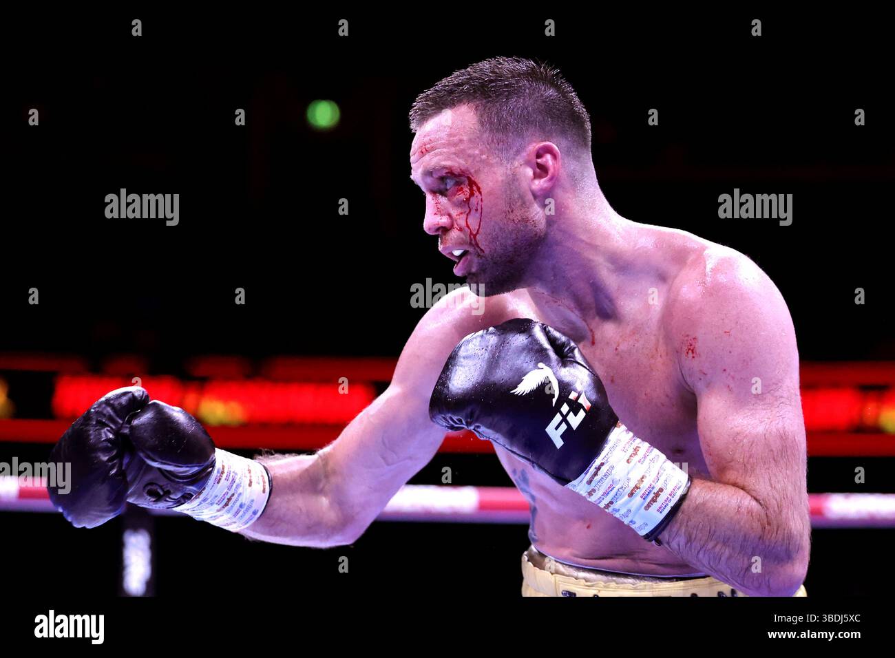 Josh Taylor with a cut above his eye during the WBO Global Welterweight bout against Ekow ...