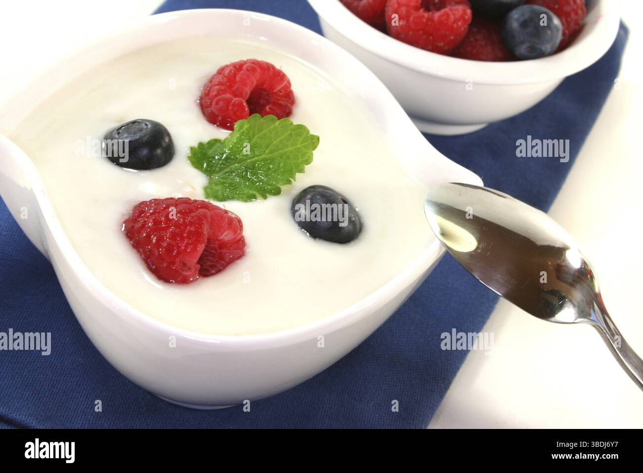 Fruit yoghurt with different types of berries Stock Photo - Alamy