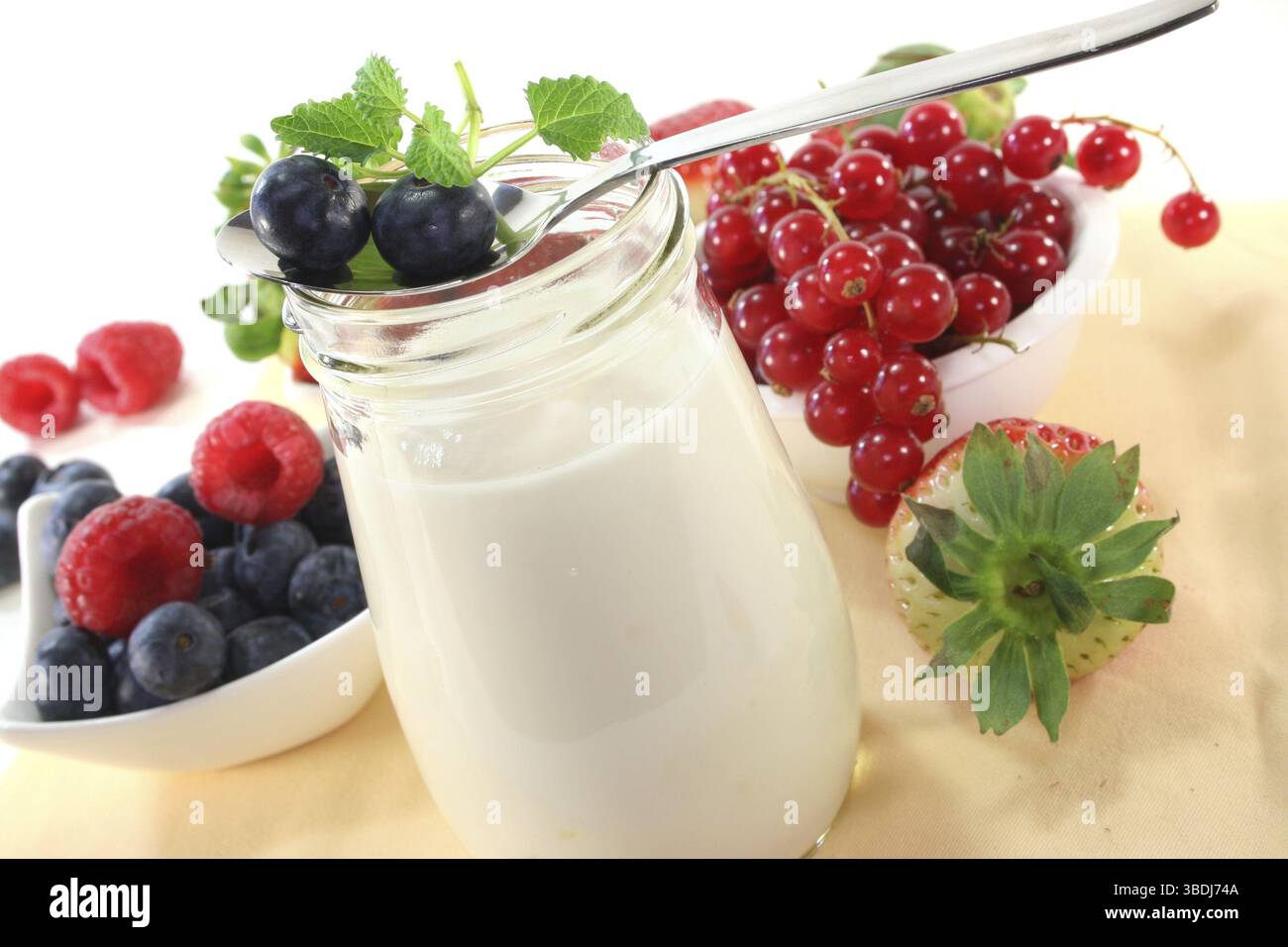 Fruit yoghurt with different types of berries Stock Photo - Alamy