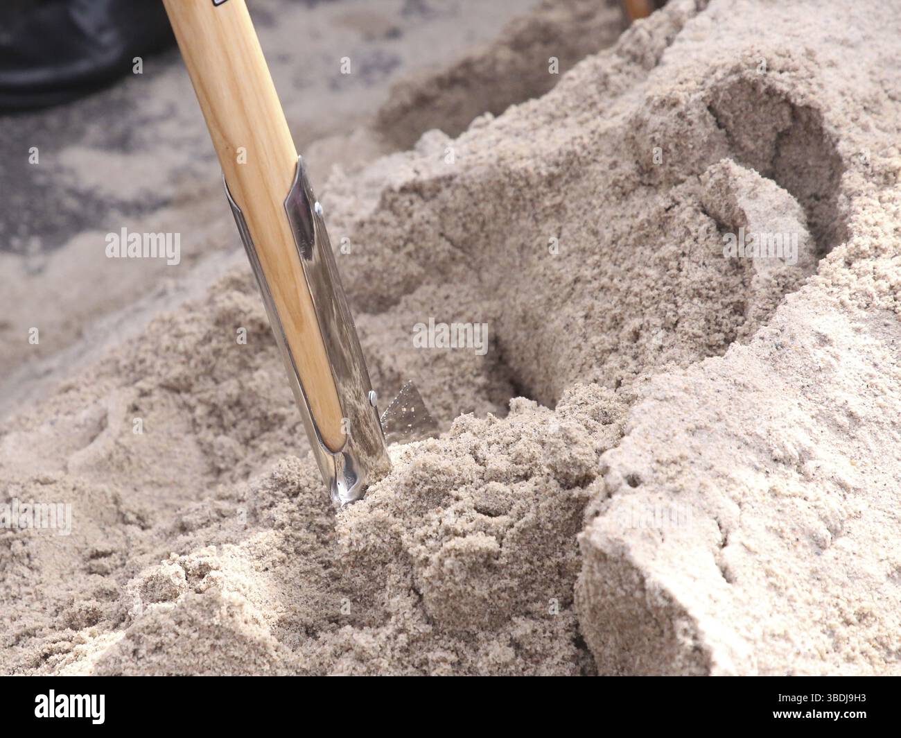 Ground-breaking ceremony in the sand Stock Photo - Alamy