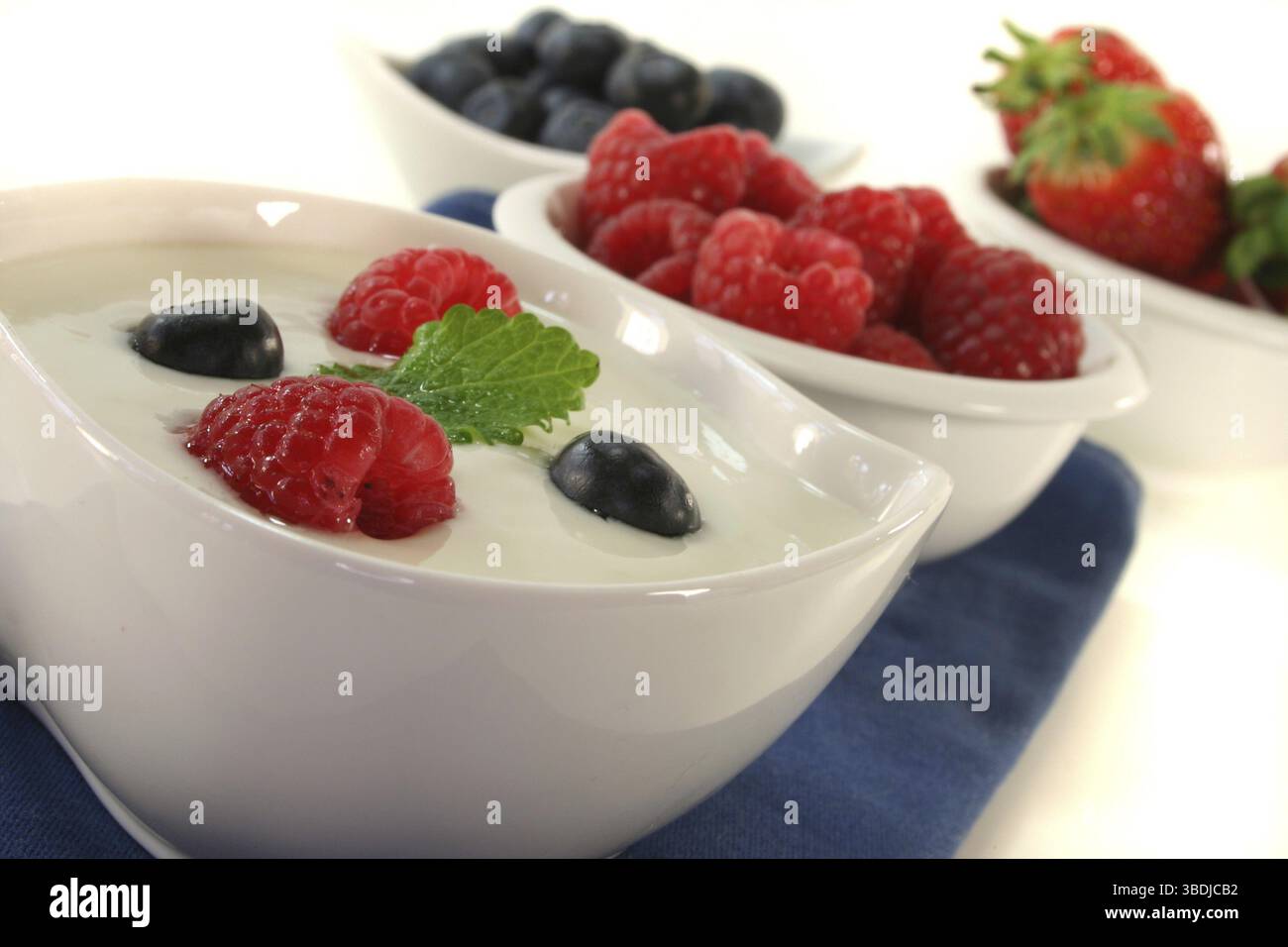Fruit yoghurt with different types of berries Stock Photo - Alamy