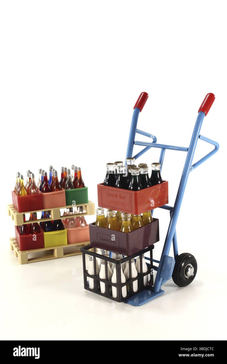 Sack trolley with cola, lemonade and milk as well as stacks of drinks ...