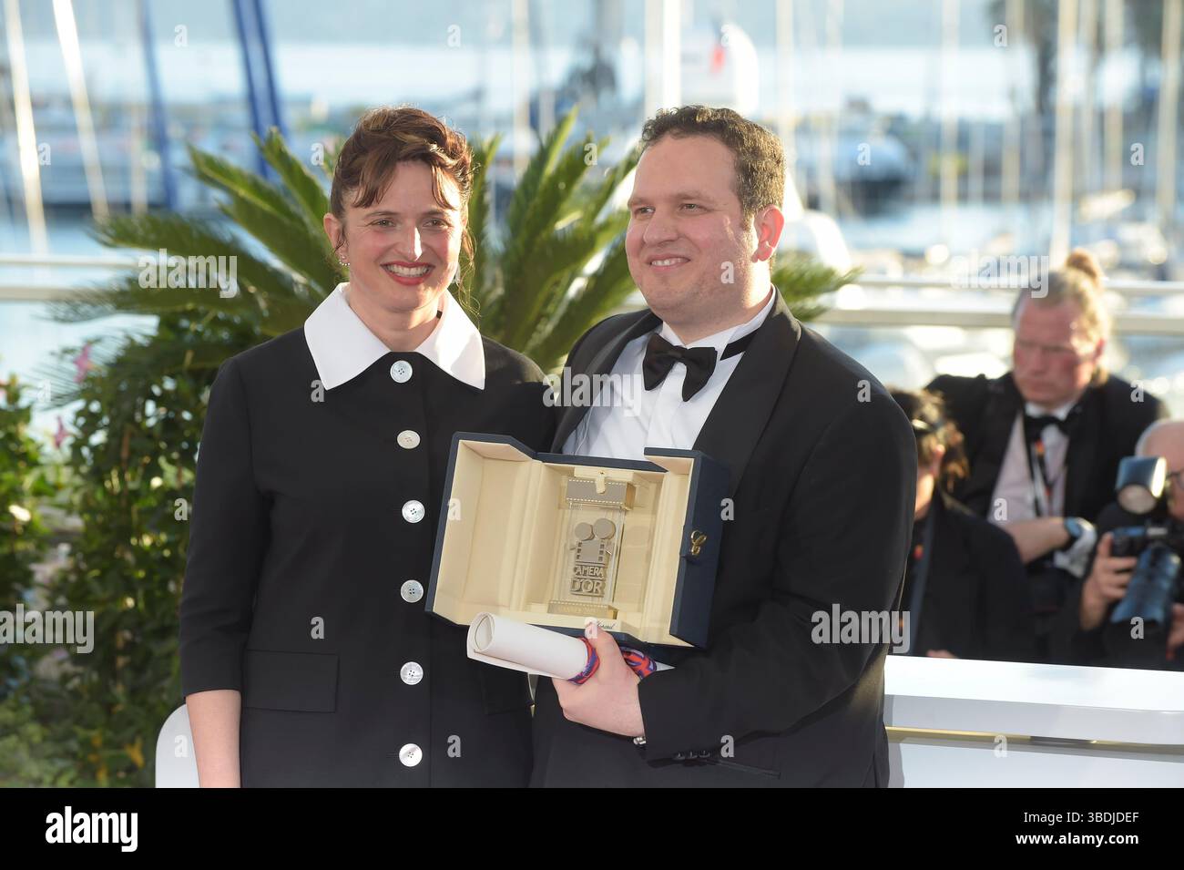 Director Hasan Hadi (r) receives the Best Debut Award before the ...