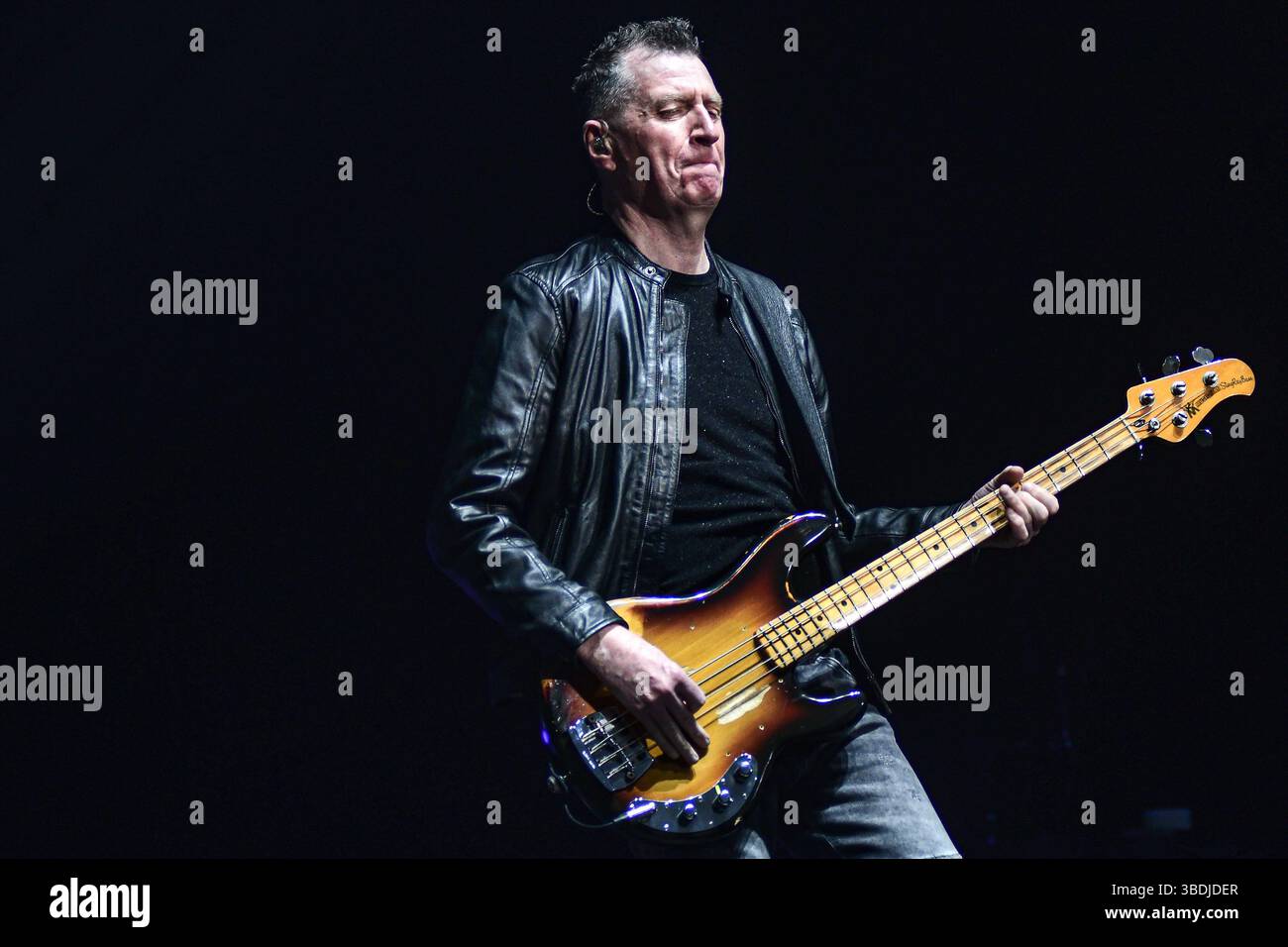 Scottish pop-rock band Simple Minds (Ged Grimes, bass), performing live ...