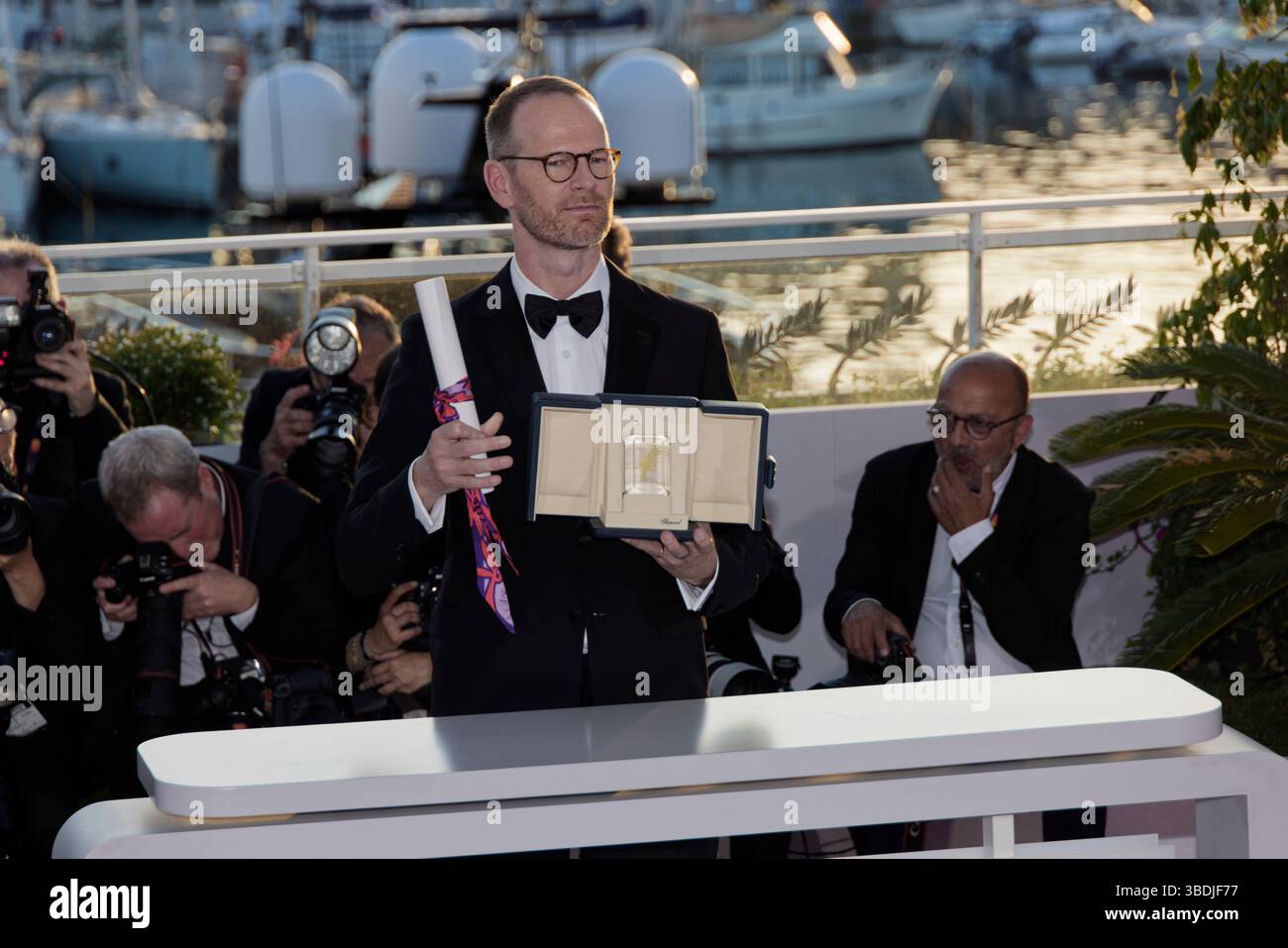Cannes, France. 24th May, 2025. Joachim Trier poses with the Grand Prix Award for ''Sentimental ...