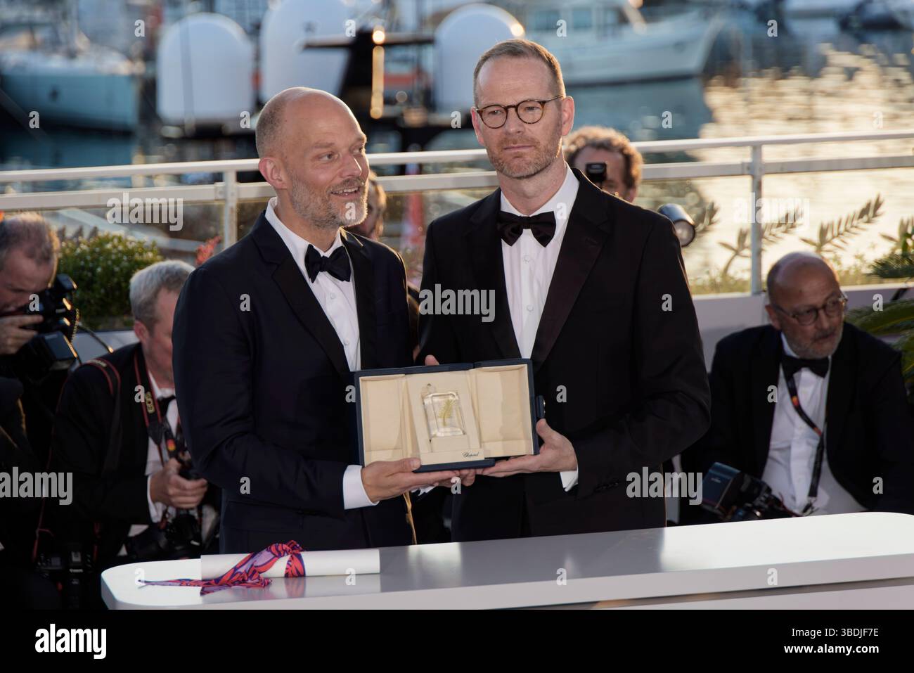 Cannes, France. 24th May, 2025. Joachim Trier poses with the Grand Prix Award for ''Sentimental ...