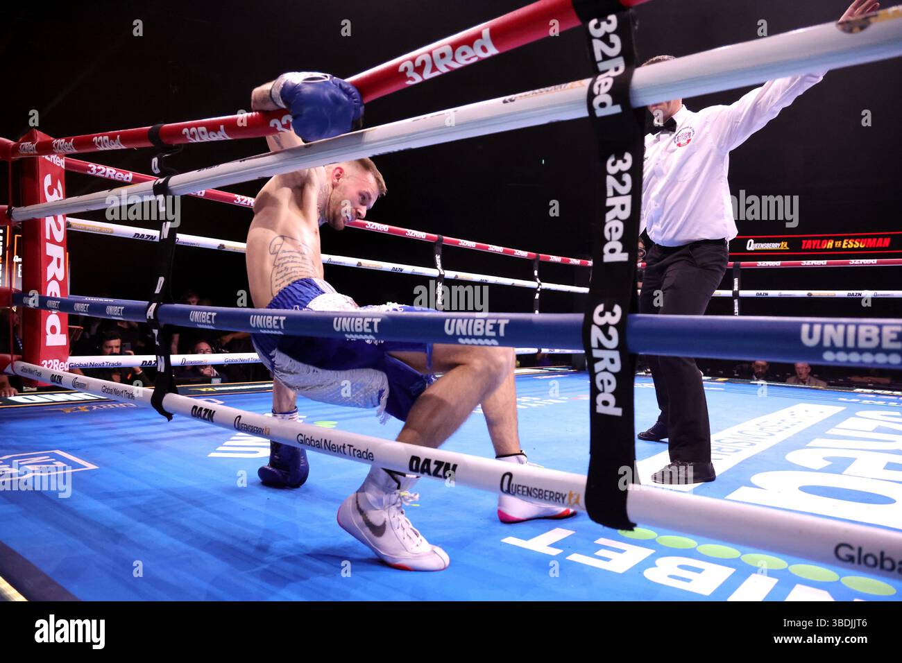 The ring referee stops the fight as Marcus Sutherland (not pictured) knocks down Dylan Nixon in ...