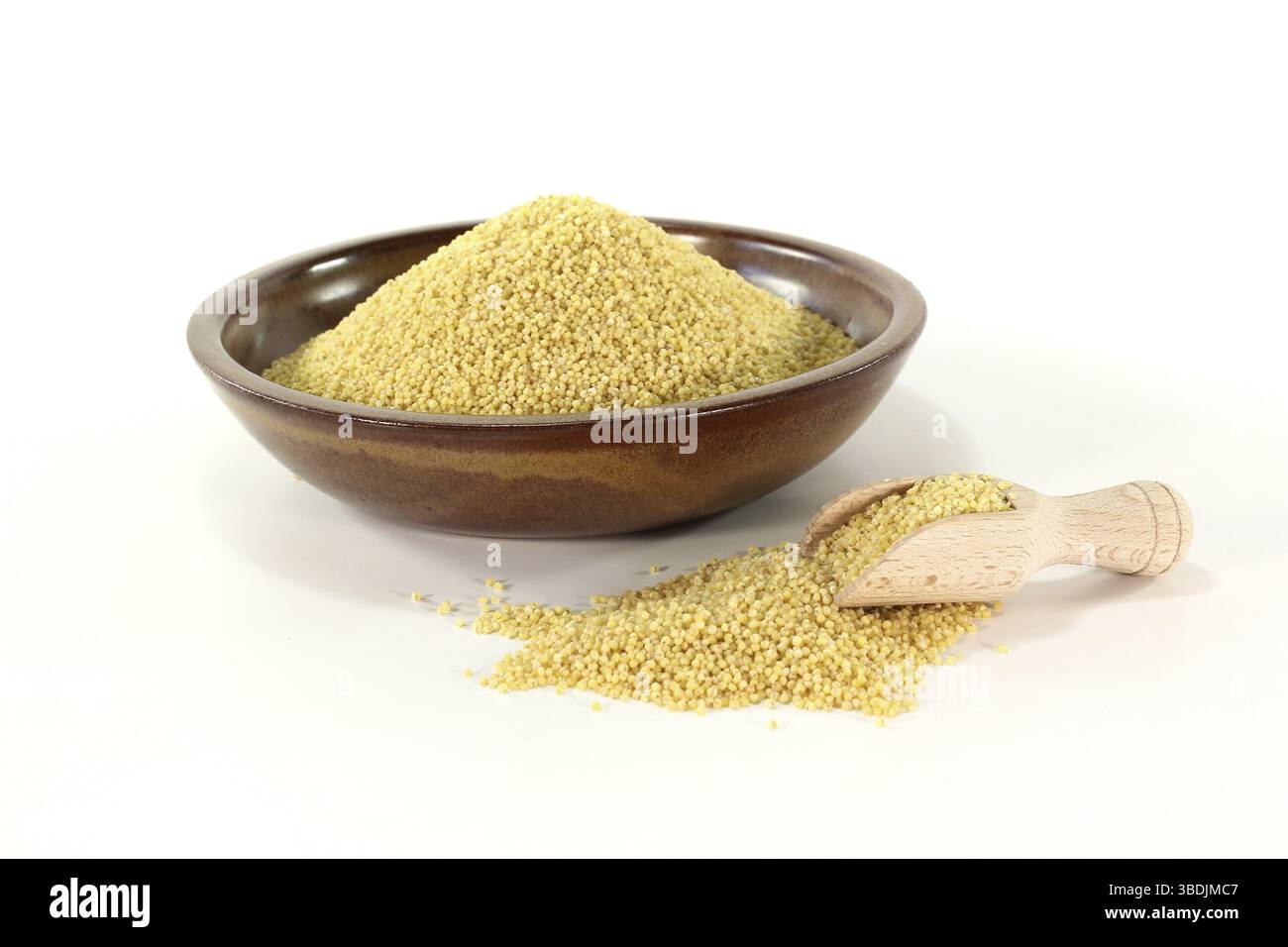 Fresh dried yellow millet in a bowl with a bushel Stock Photo - Alamy