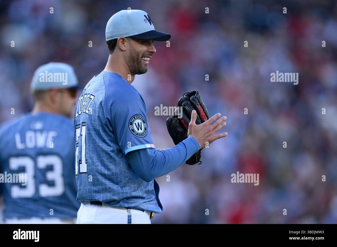 Washington Nationals relief pitcher Jorge Lopez reacts after a baseball ...