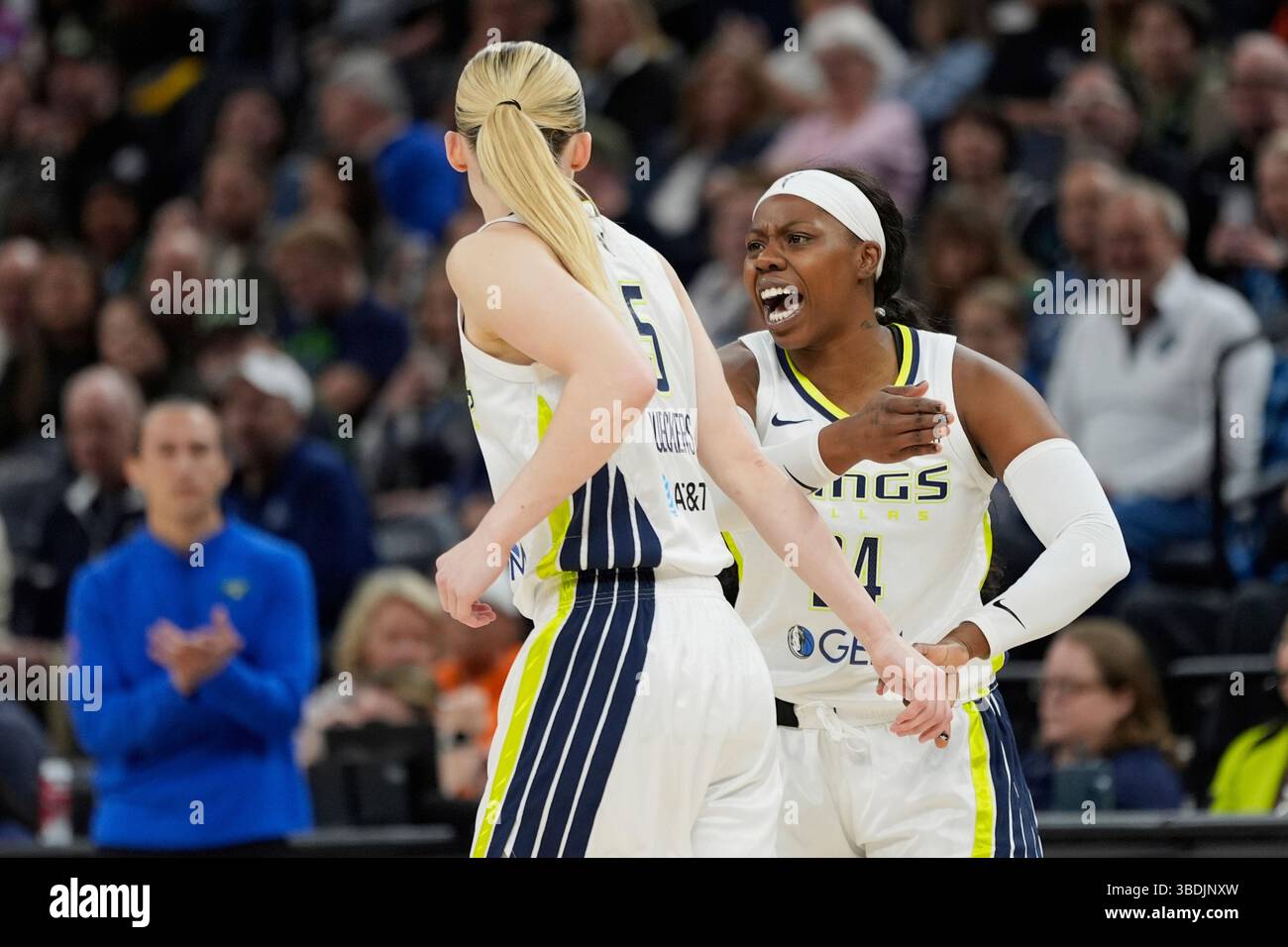 Dallas Wings guard Arike Ogunbowale (24) reacts next to guard Paige ...