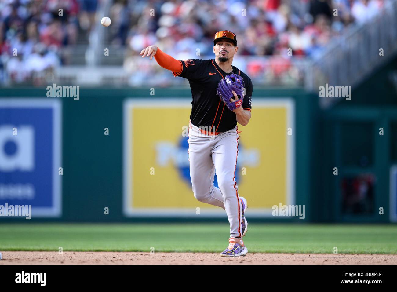 San Francisco Giants shortstop Willy Adames throws to first base to put ...