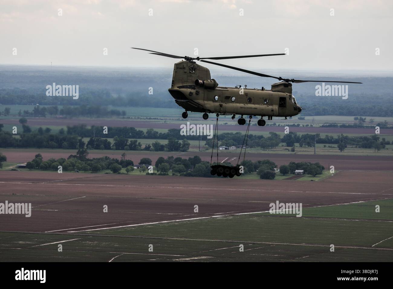 A CH-47 Boeing Chinook transports gear assigned to 1st Brigade Combat ...