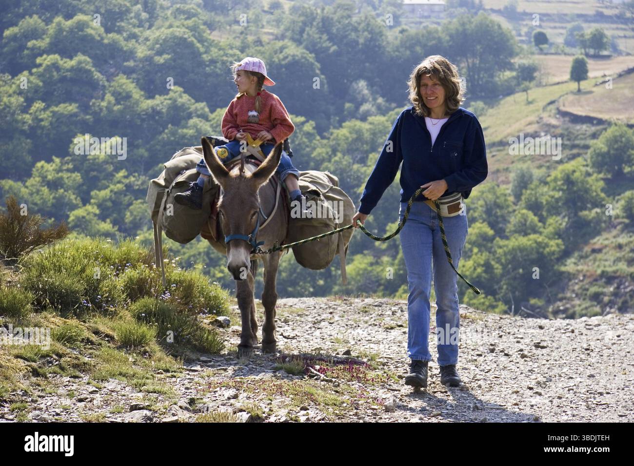 Mother and daughter with donkey, donkey walk in the Cevennes, Cevennes ...