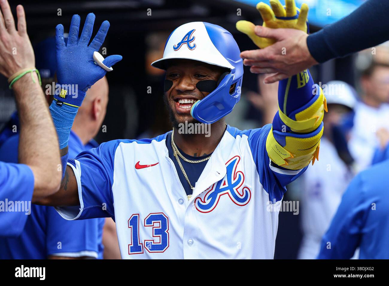 Atlanta Braves' Ronald Acuna Jr. (13) high-fives teammates in the ...