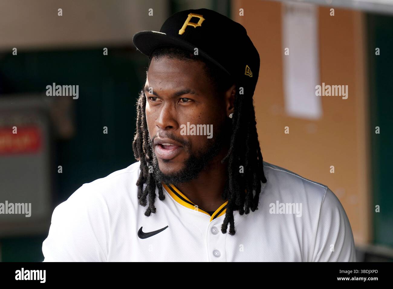 Pittsburgh Pirates' Oneil Cruz stands in the dugout before a baseball ...