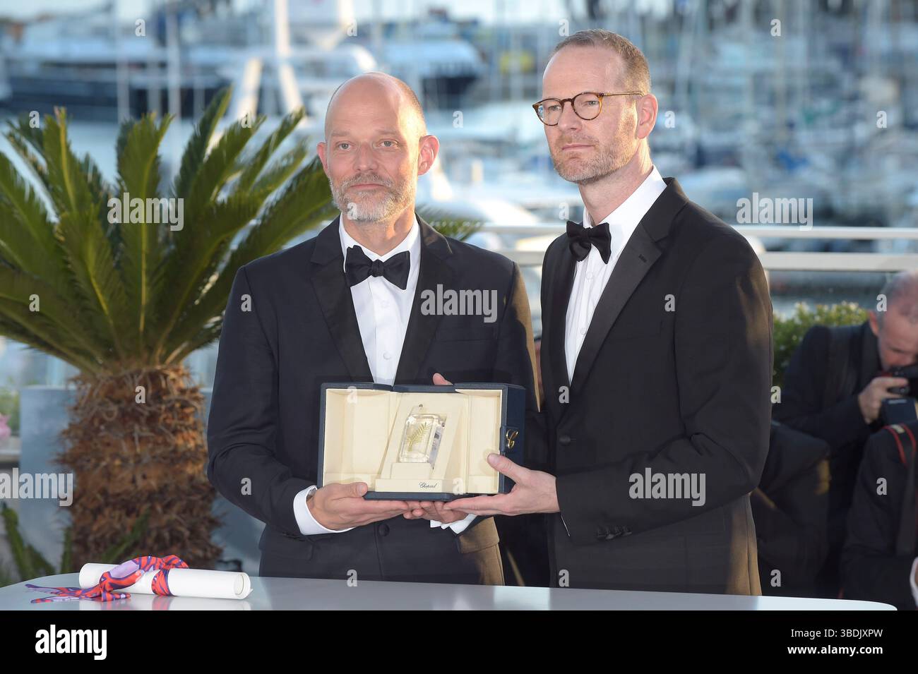 Cannes, France. 24th May, 2025. CANNES, FRANCE - MAY 24: Eskil Vogt and Joachim Trier pose with ...