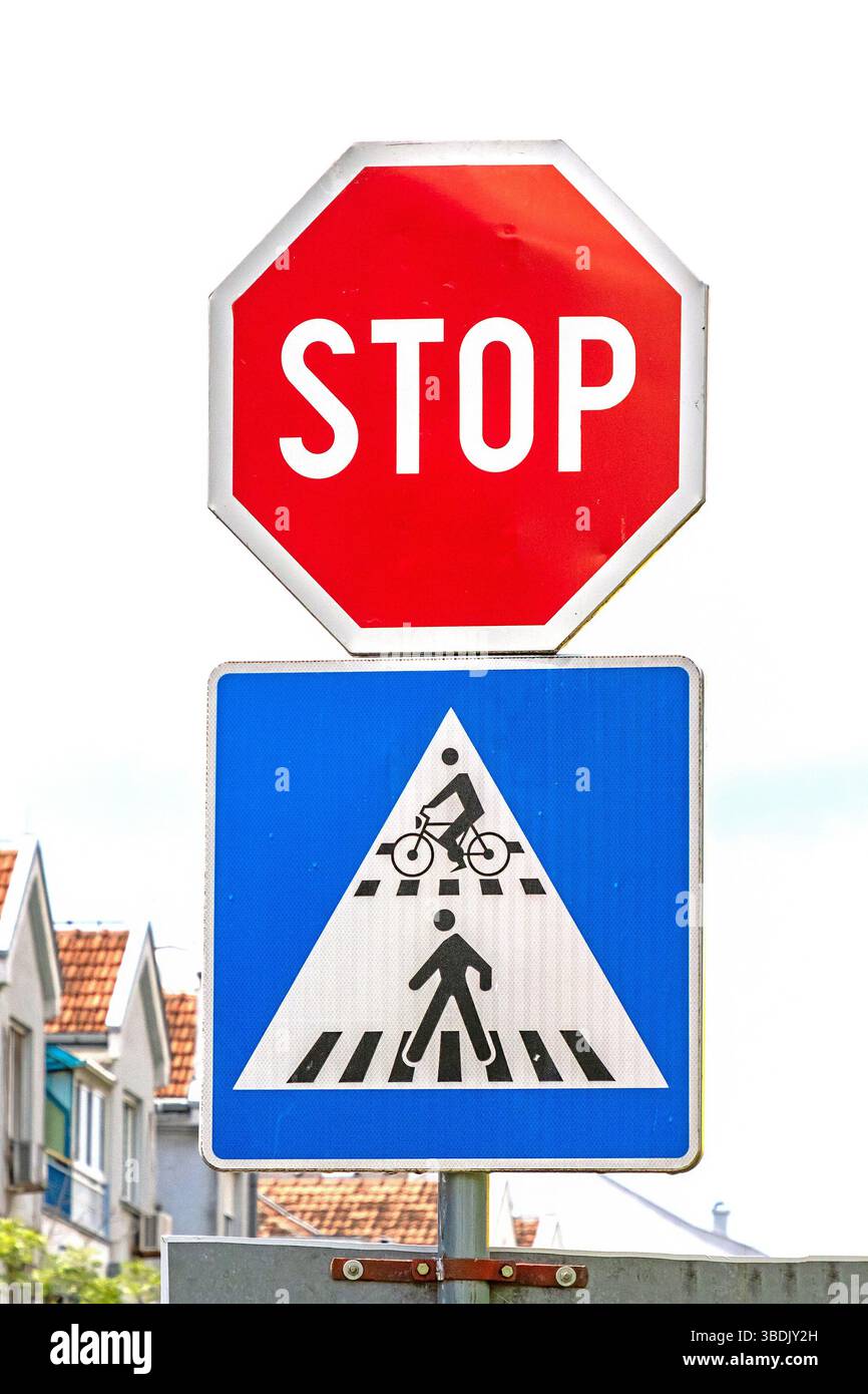 Pedestrian and bicycle paths traffic signs outside on a board in urban ...