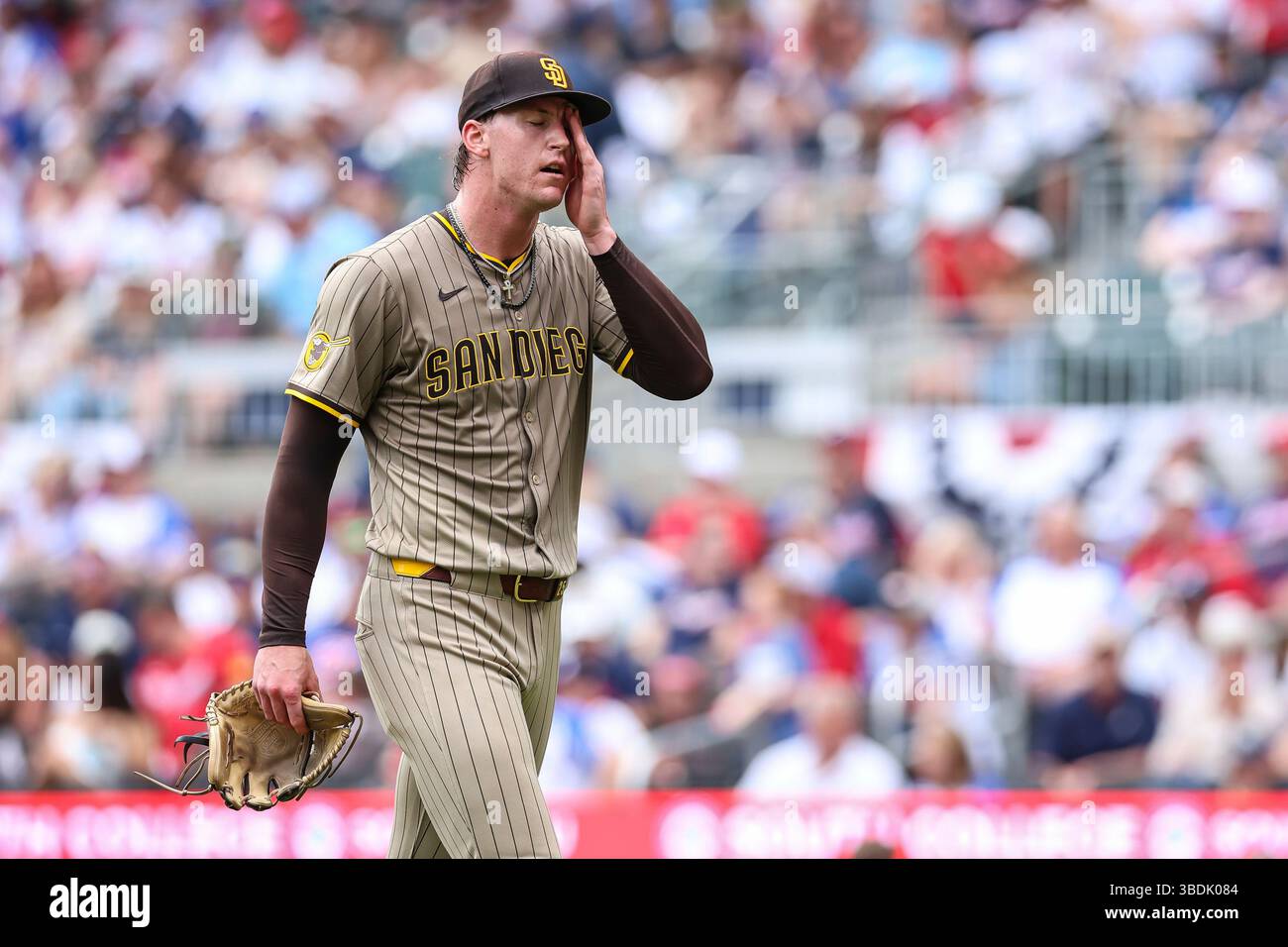 San Diego Padres pitcher Sean Reynolds reacts while exiting a baseball ...