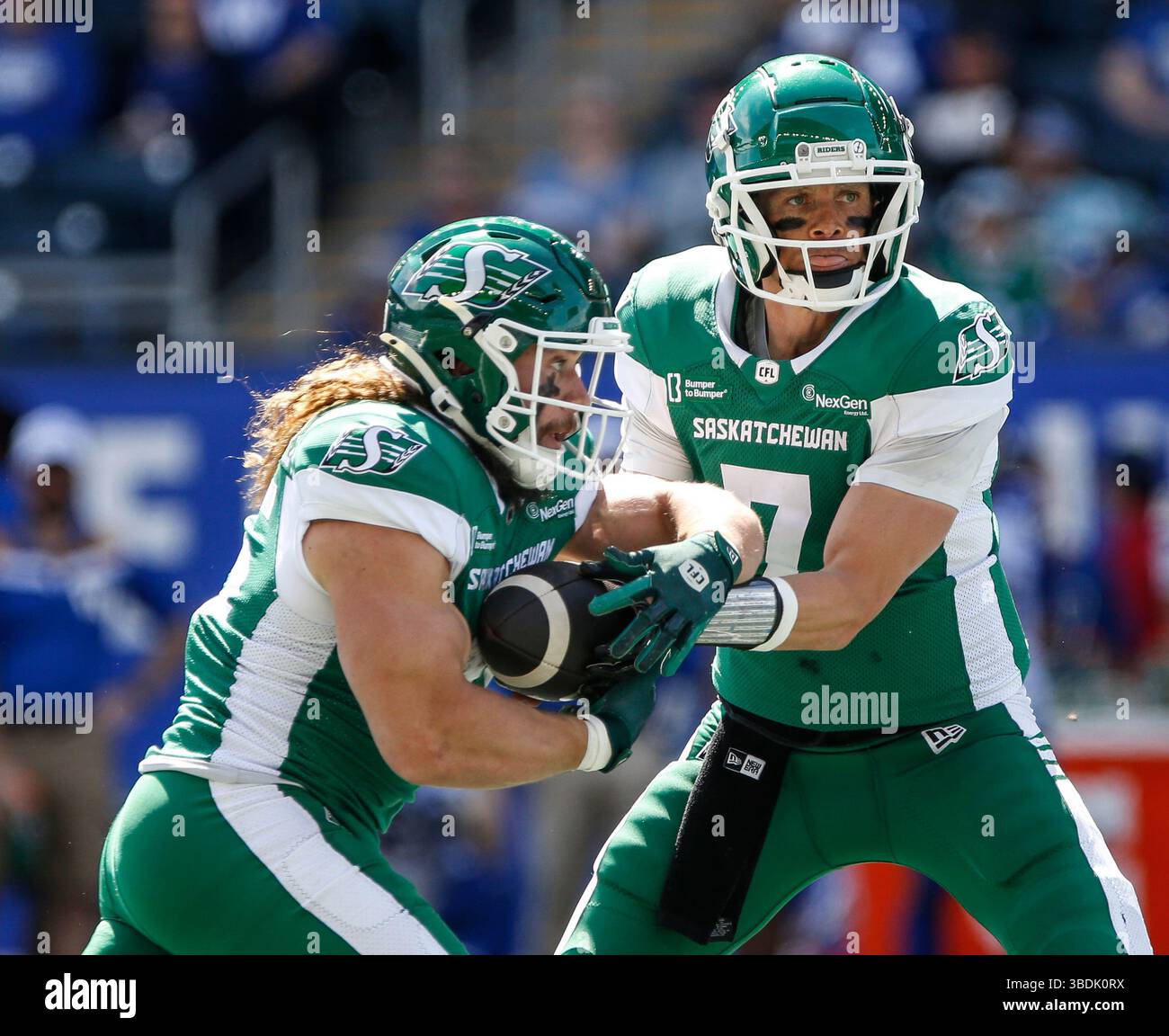 Winnipeg, Canada. 24th May, 2025. Saskatchewan Roughriders quarterback Trevor Harris (7) hands ...