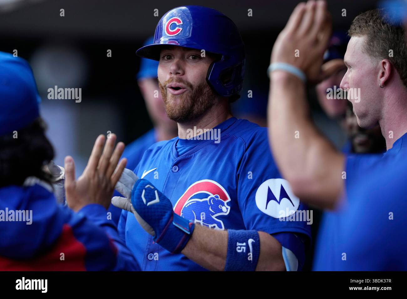 Chicago Cubs' Carson Kelly celebrates in the dugout after hitting a ...