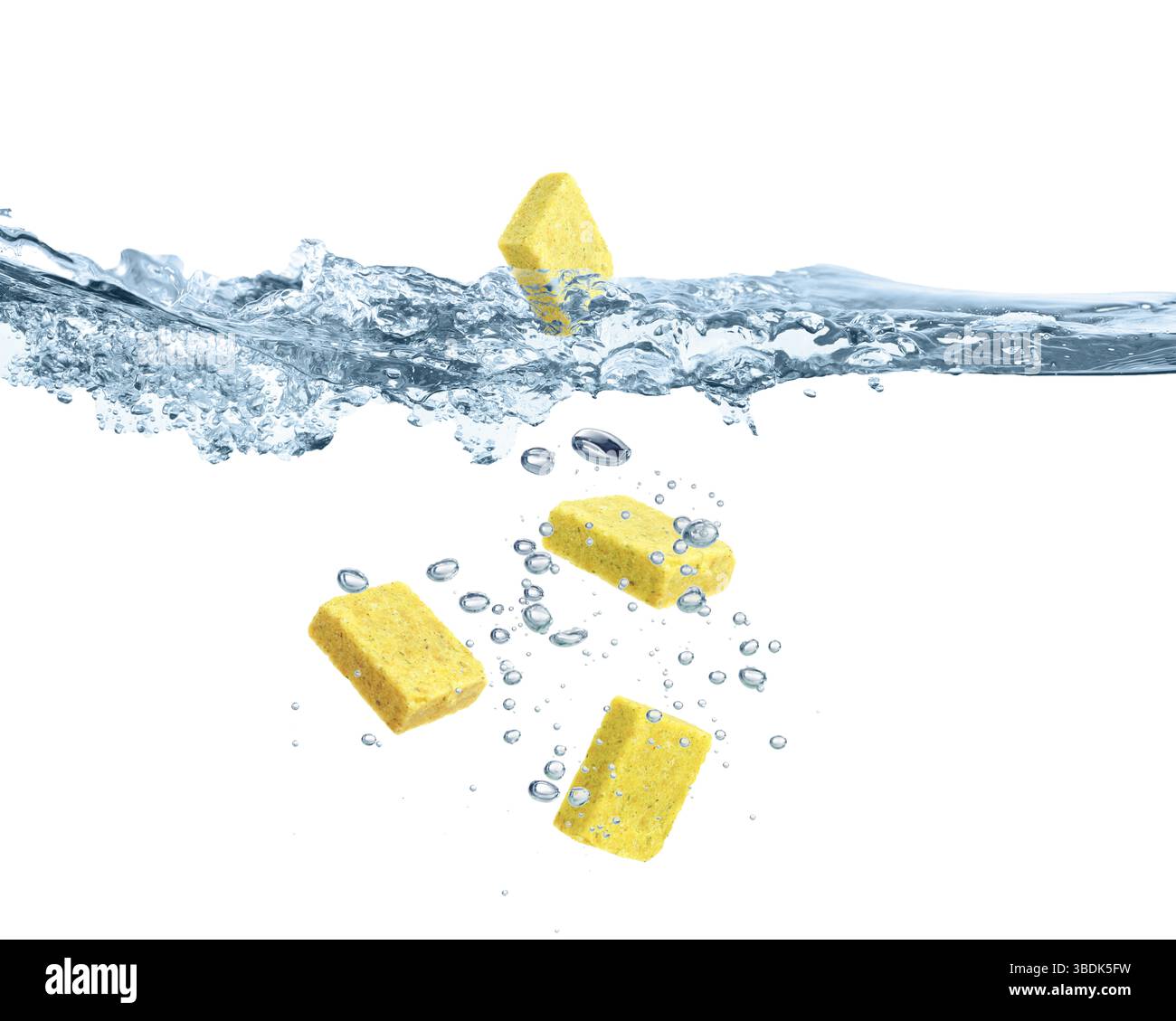 Bouillon cubes falling into water on white background Stock Photo - Alamy