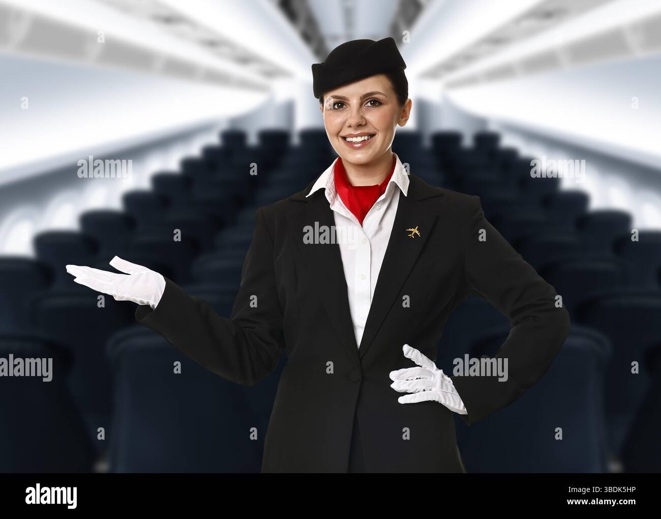 Smiling stewardess welcoming passengers in airplane cabin Stock Photo ...