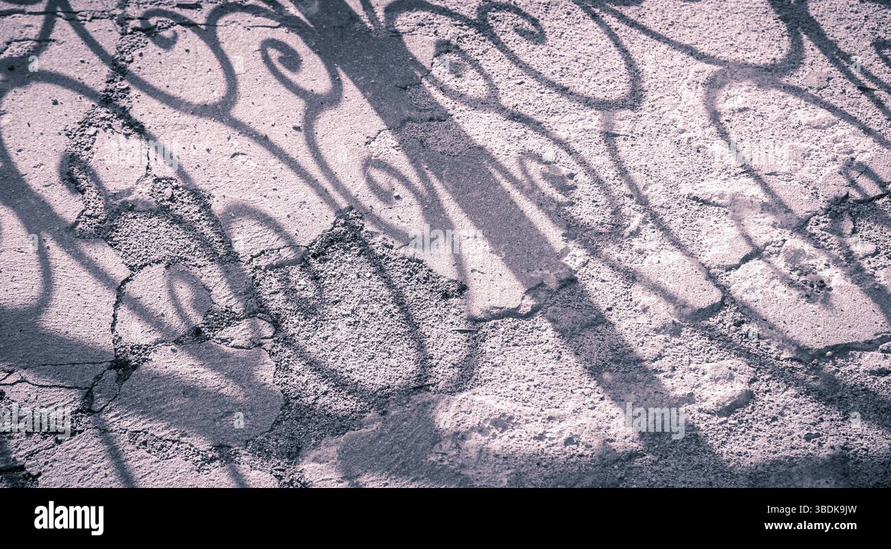 Vintage style photo of an ornamental fence shadow Stock Photo - Alamy