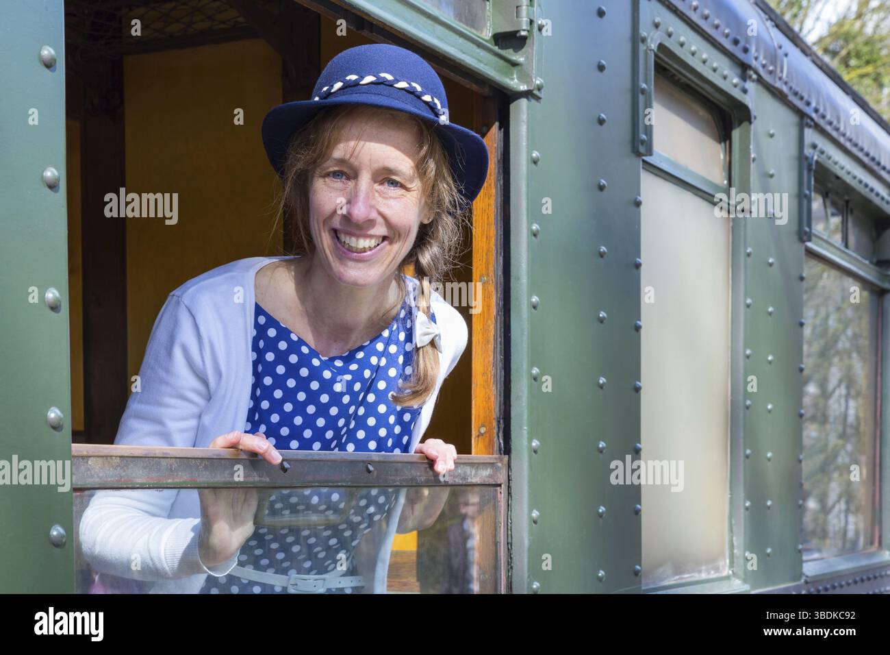 Caucasian middle aged woman dressed in blue old-fashioned clothes in ...