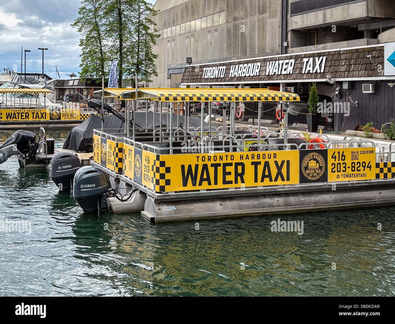 Toronto Harbour Water Taxi pontoon boat with yellow and black ...