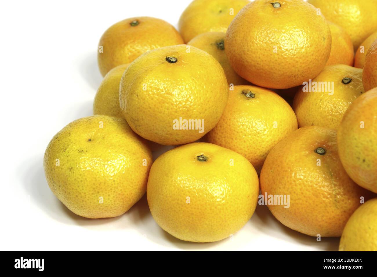 Fresh tangerines on white background Stock Photo - Alamy