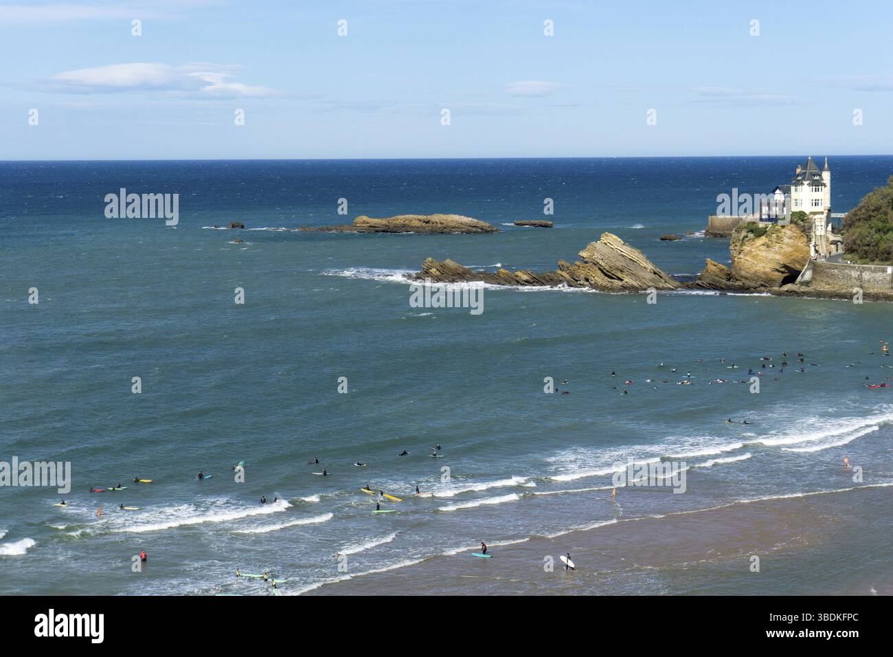 A view of many surfers on the Plage de la Cote Basque Beach in Biarritz ...