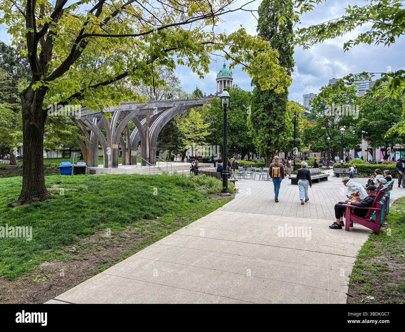 St. James Park in Toronto features a modern wooden pavilion, pathways ...