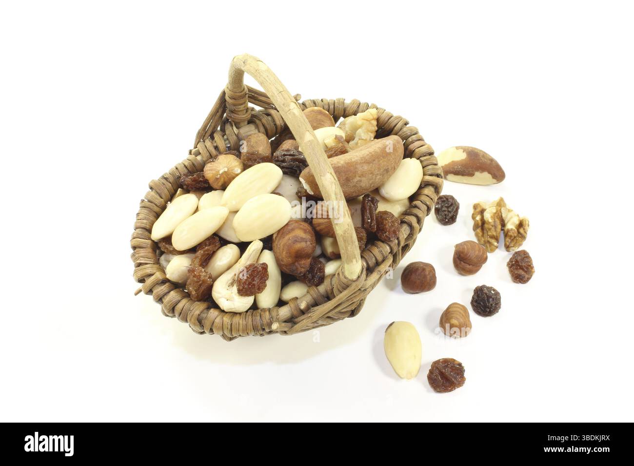 Fresh crunchy nut mix with sultanas as a snack against a light-coloured ...