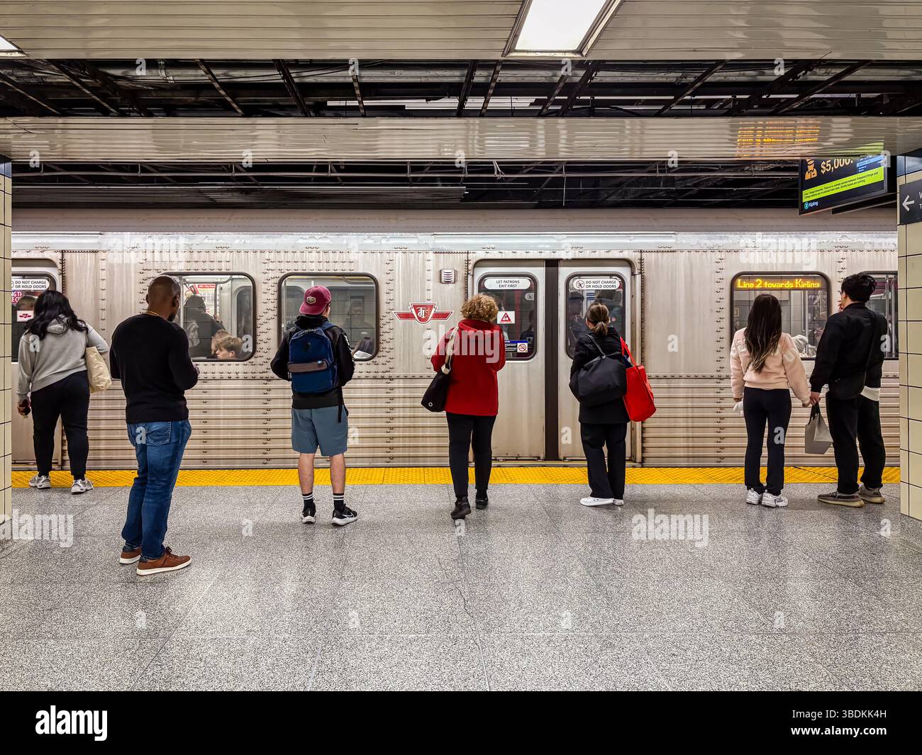 Subway station in Toronto, Canada with people waiting on the platform ...